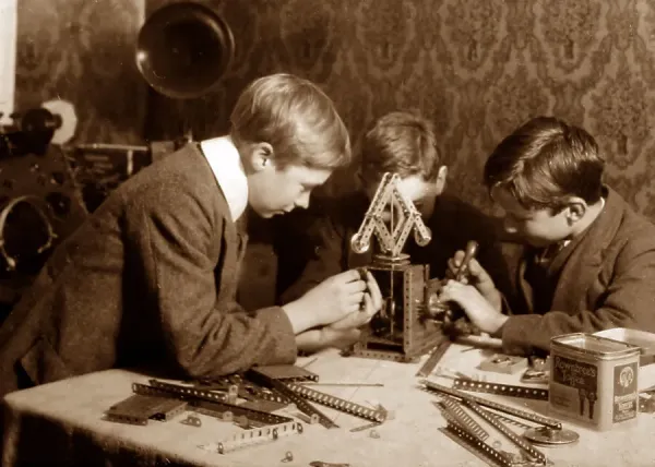 Boys playing with Meccano, early 1900s Date: early 1900s