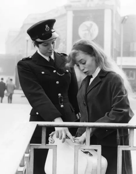 Woman police officer and woman with suitcase Our beautiful Wall Art and ...